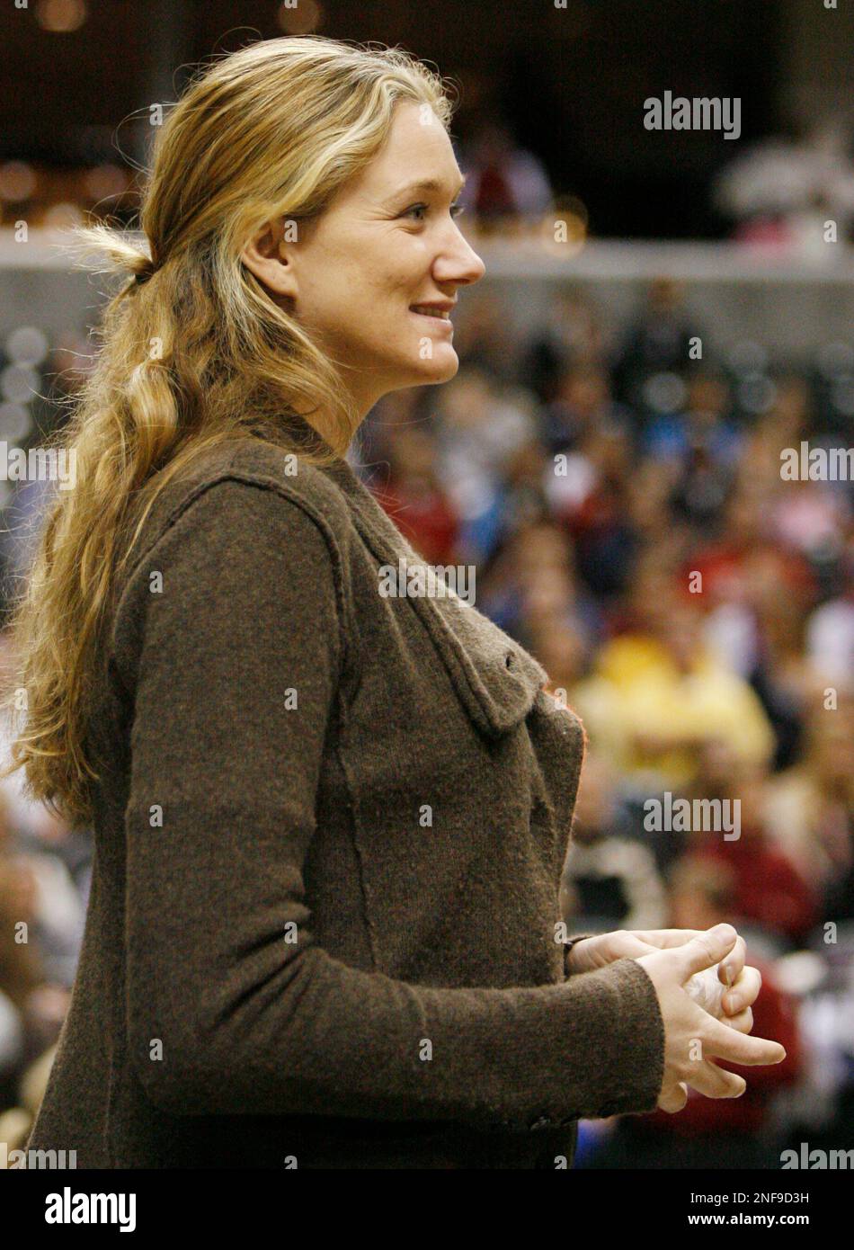 Kari Walsh listens as she is introduced to the crowd before the matches ...