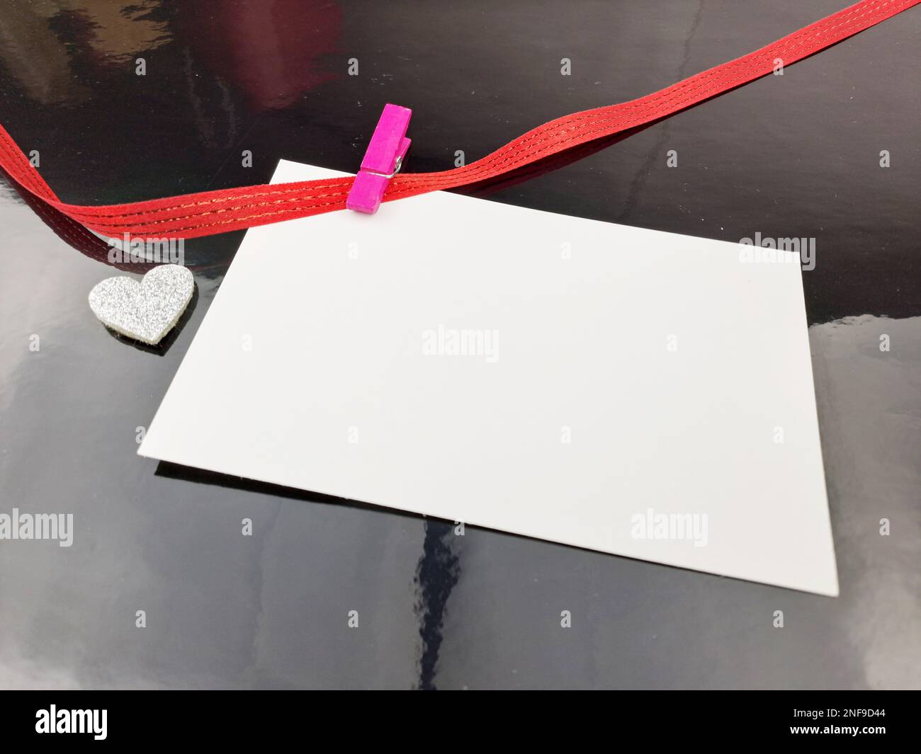 Valentine's Day White card hanging on red string with clothespin ...