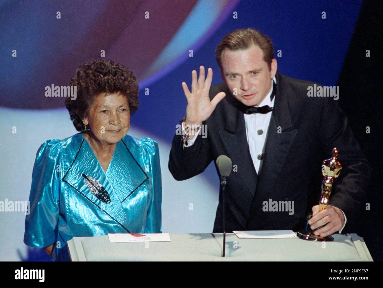 Michael Blake accepts the Oscar for best adapted screenplay for "Dances ...