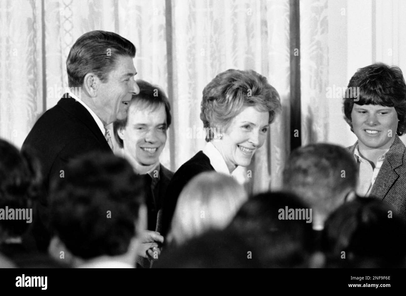 Olympic medalist, figure skater, Scott Hamilton, is framed by President ...