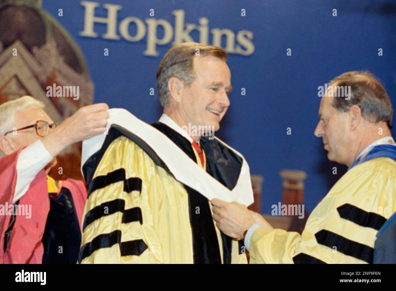 U.S. President George H. Bush is presented an academic hood ...