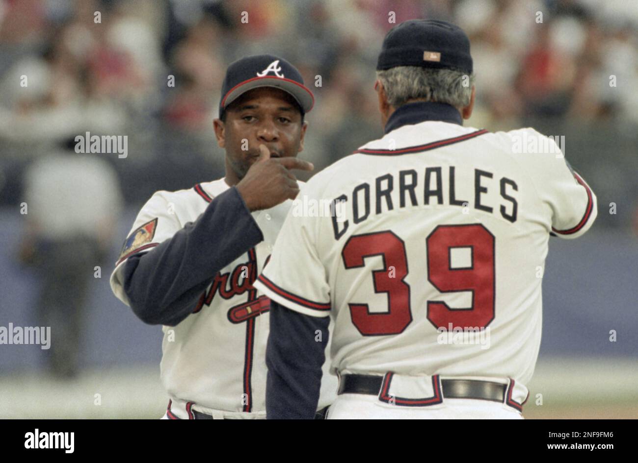 Terry Pendleton of the Atlanta Braves, left, talks with third base ...