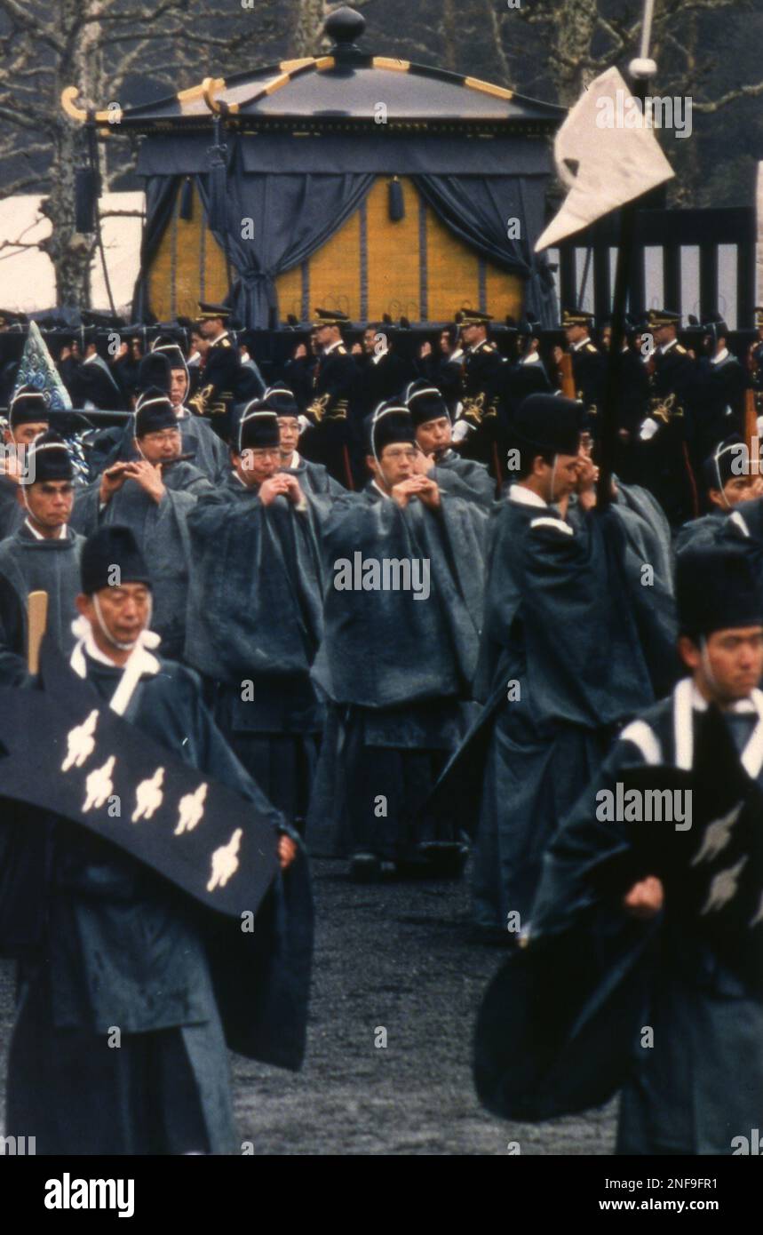 Clad in traditional costumes and head gear, Japanese court musicians ...