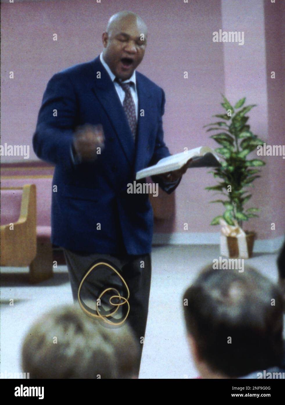 Heavyweight boxing champion George Foreman is pictured preaching ...