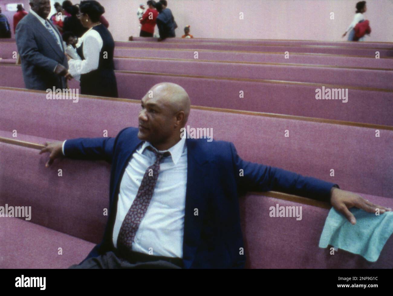 Heavyweight boxing champion George Foreman is pictured relaxing on a ...