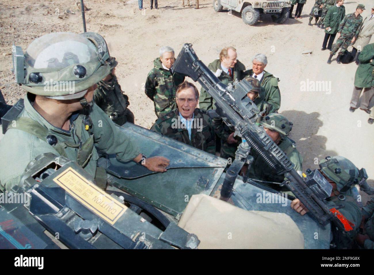 President George Bush talks with a soldier at Fort Irwin Army Base ...