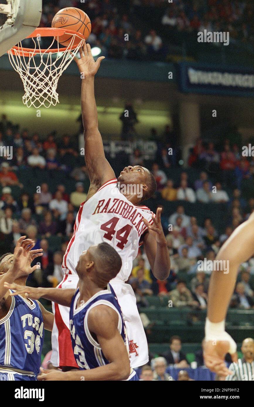 Arkansas center Darnell Robinson (44) guides the ball to the basket over Tulsa forwards Gary ...