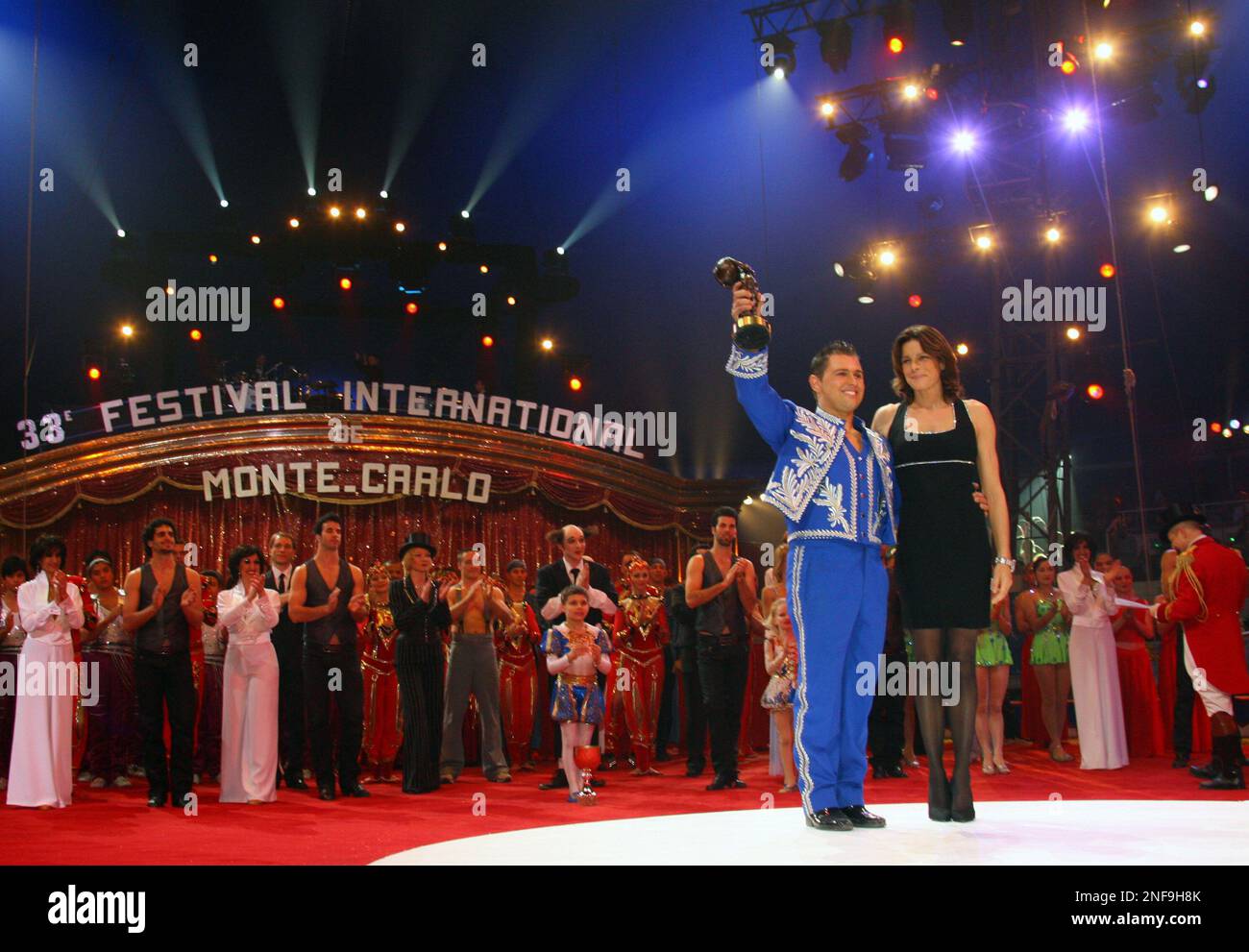 Roger Falck poses with a Bronze Clown Award next to Princess Stephanie ...