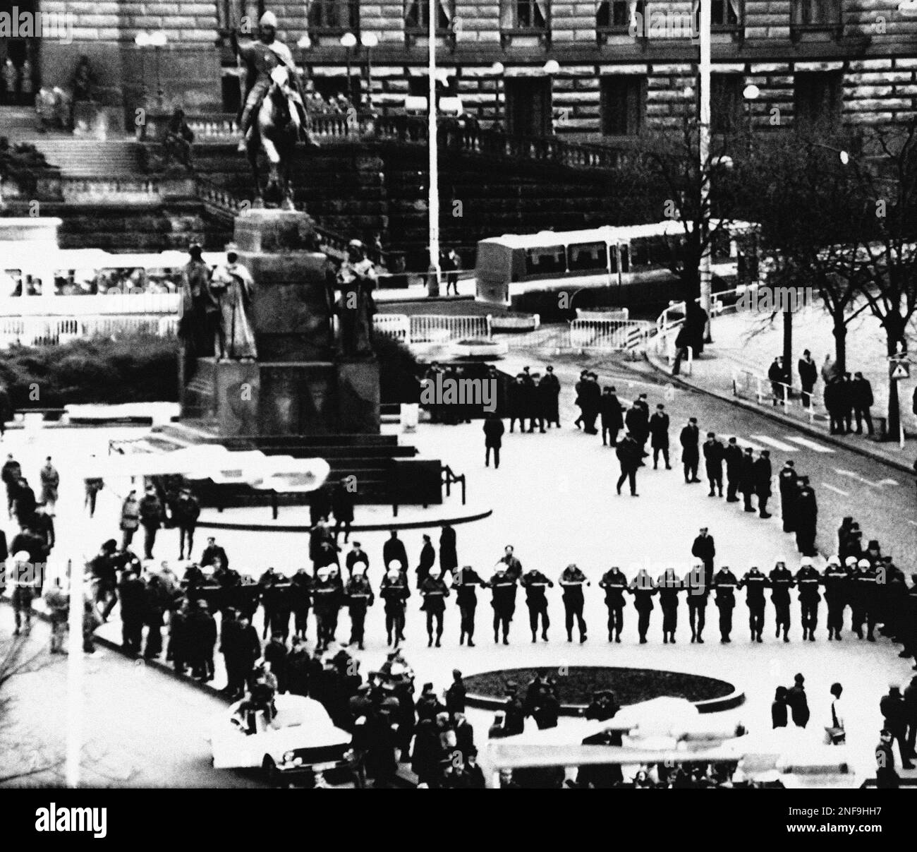 Riot police and militia block the area around the statue to Wenceslas ...