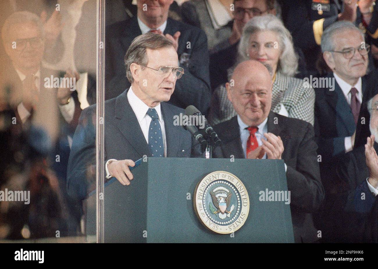 President George Bush, surrounded by high-security, bullet-resistant ...
