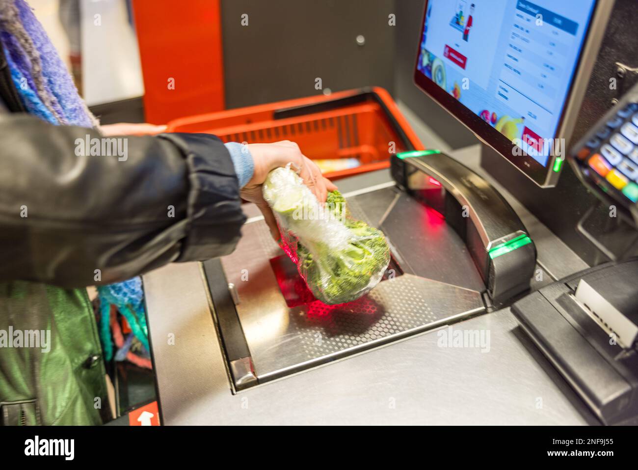 Cottbus, Germany. 14th Feb, 2023. A customer feeds packaged broccoli ...