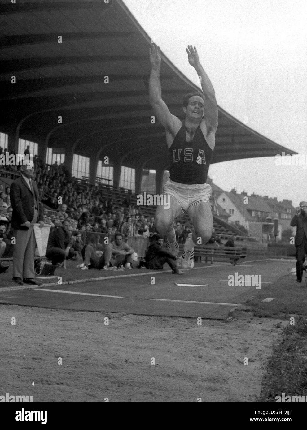 U.S. American athlete William Toomey, flies in the air during the long ...