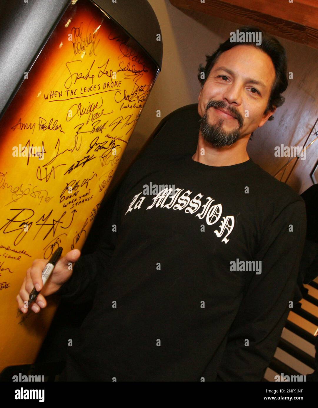 Actor Benjamin Bratt of "La Mission" signs a speaker at the Gibson ...