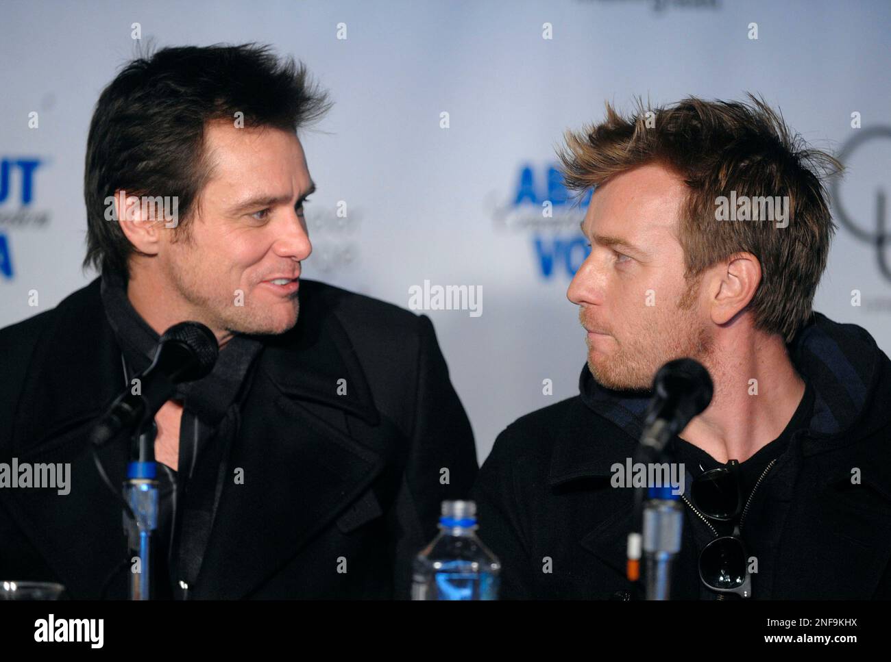 Actor Jim Carrey, left and Ewan McGregor speak at a press conference ...