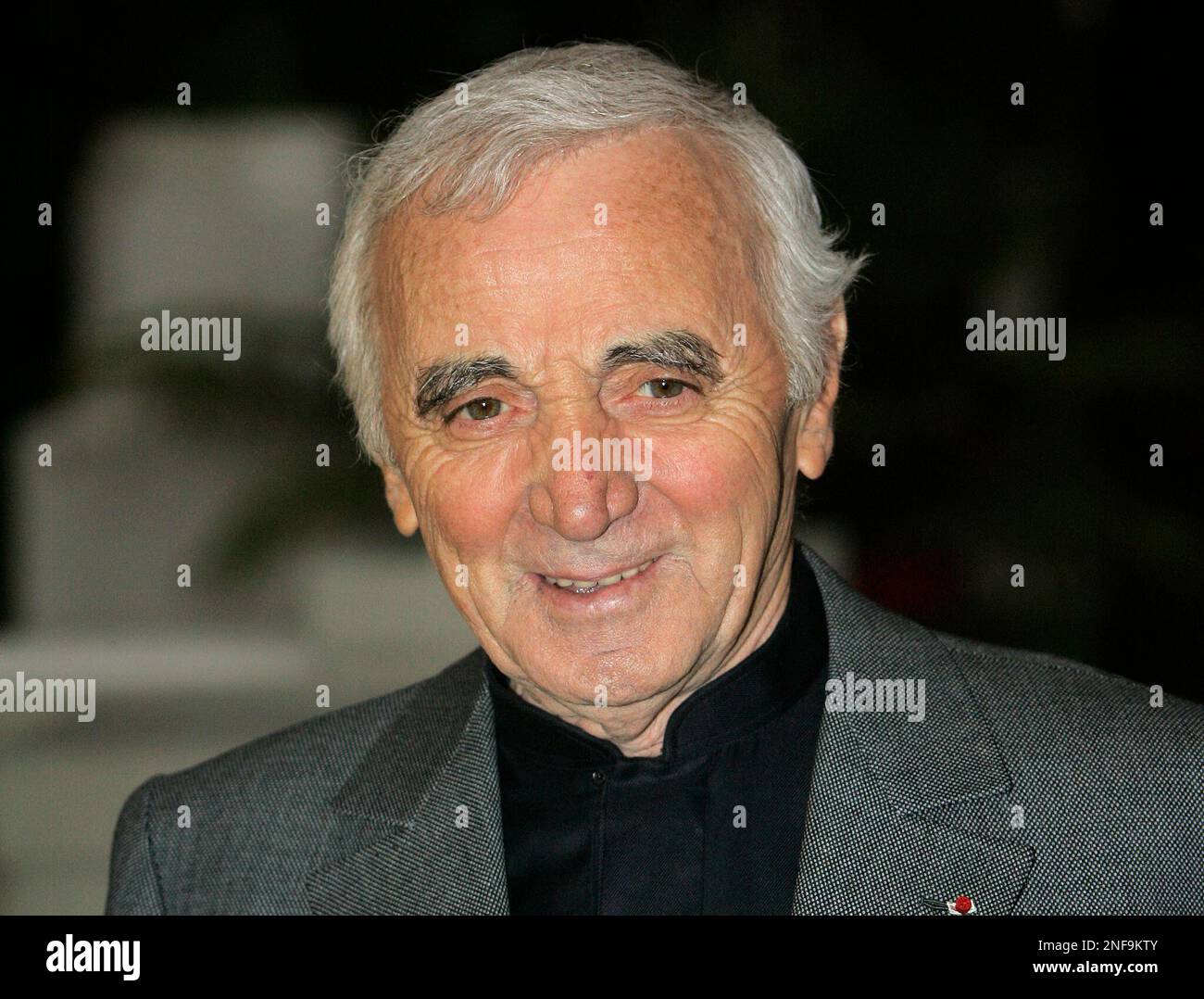 French singer Charles Aznavour poses for a photocall during the 43rd ...