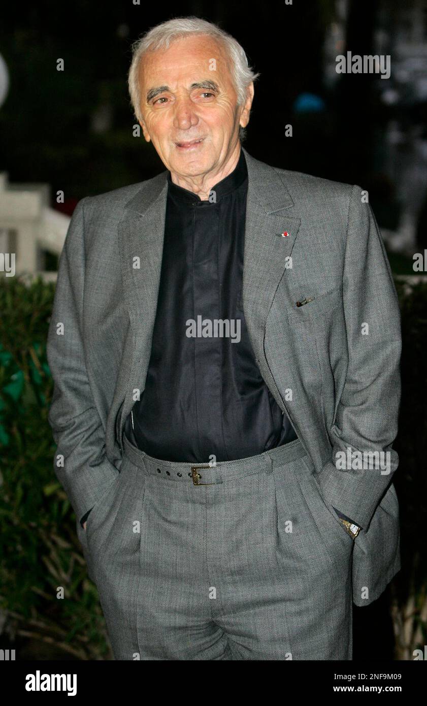 French singer Charles Aznavour poses for a photocall during the 43rd ...