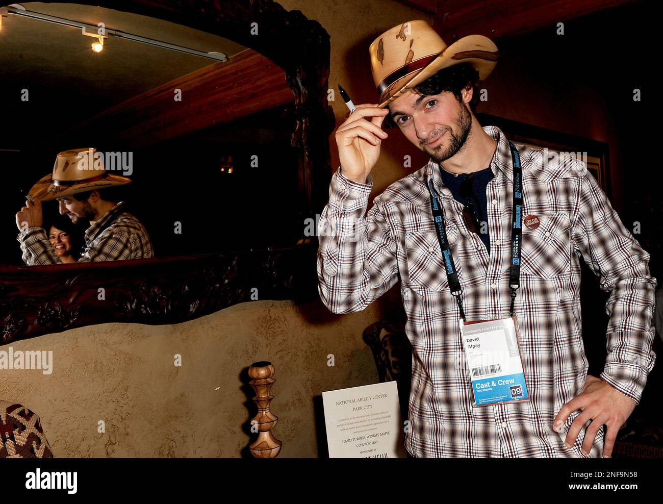 Actor David Alpay signs a cowboy hat at the Gibson Guitar Lounge during ...