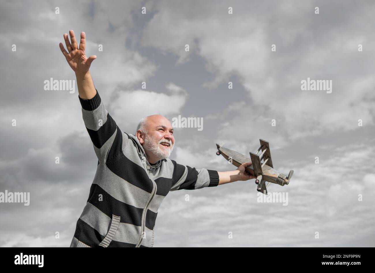happy retirement. mature granddad with toy. retired old man outdoor ...