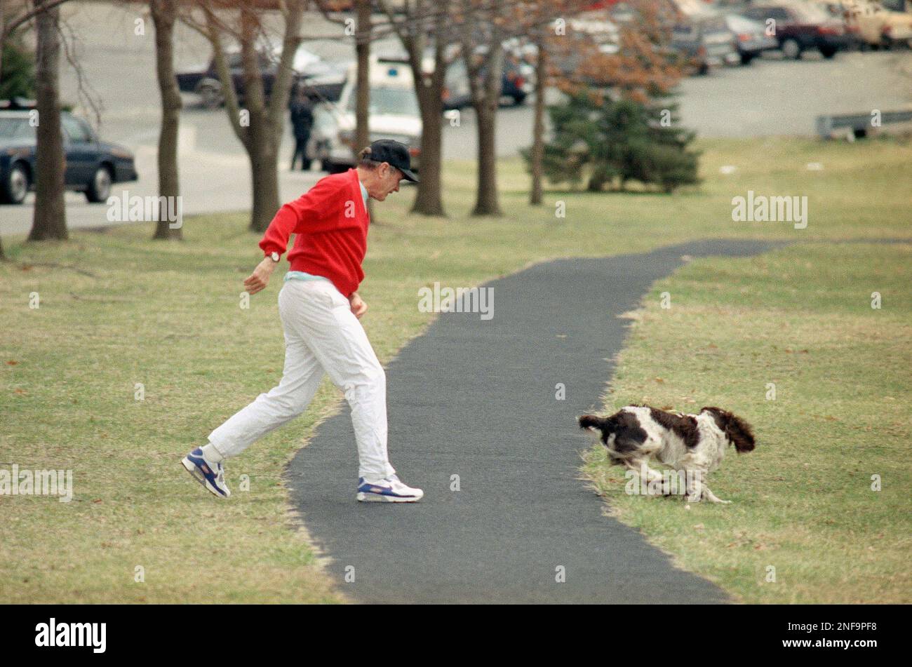President George Bush follows his dog Ranger as he starts out jogging ...