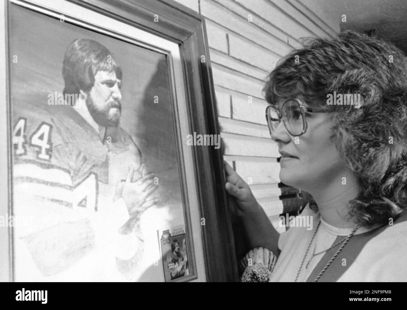 Donna Kotar looks at a painting of her husband, Doug, in his New York ...