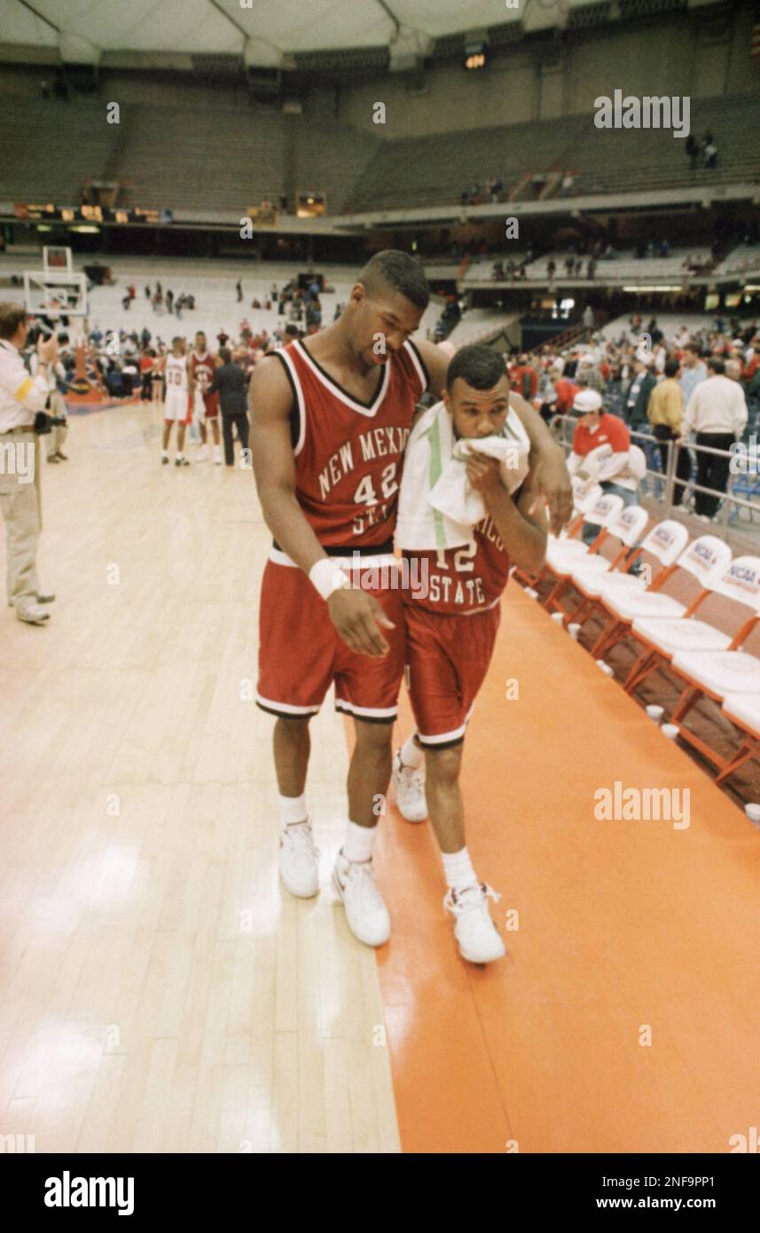 New Mexico States Cliff Reed, left, consoles teammate Sam Crawford ...