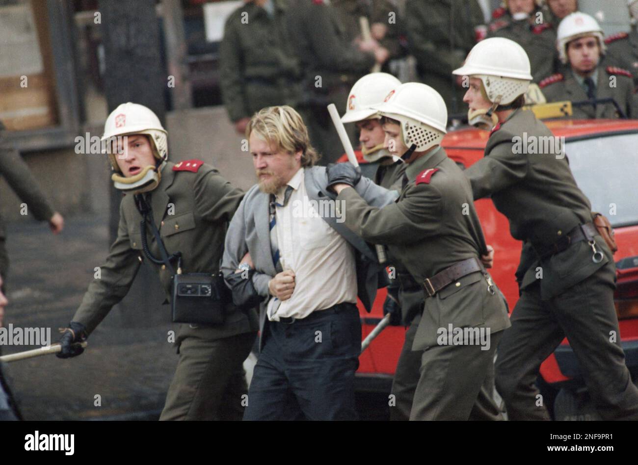 A protester is detained by four riot policemen in Wenceslas Square in ...