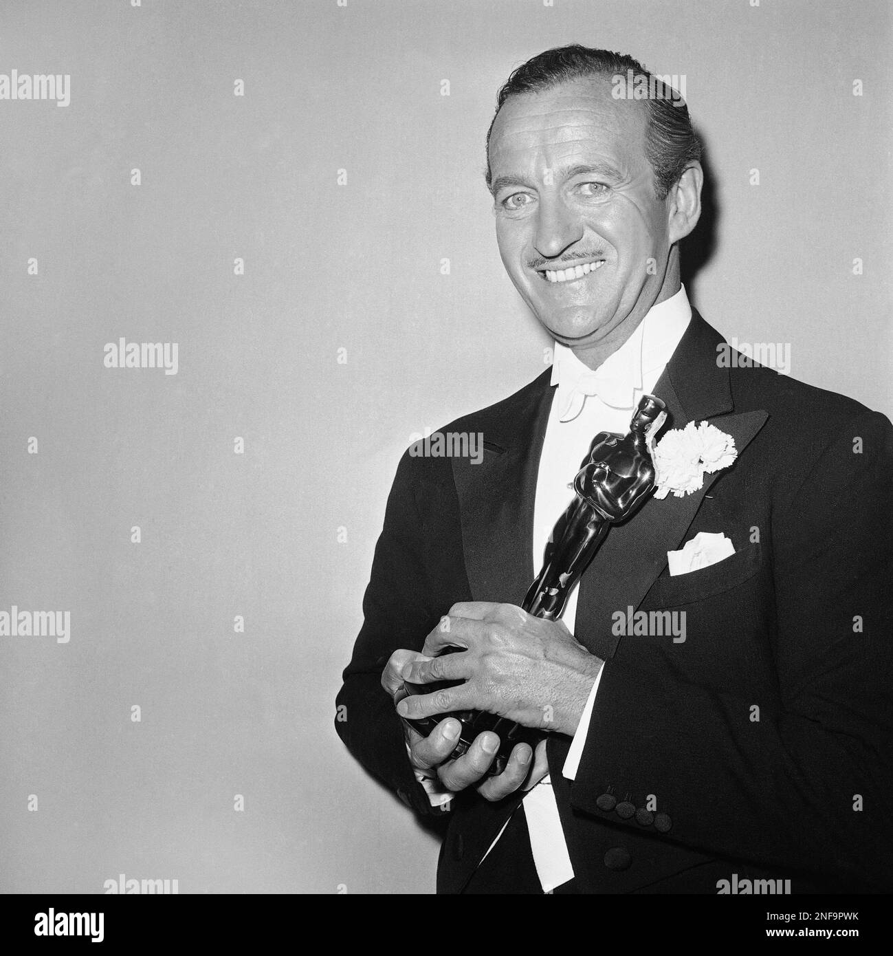 British actor David Niven, holds his Oscar for best actor, in Hollywood ...