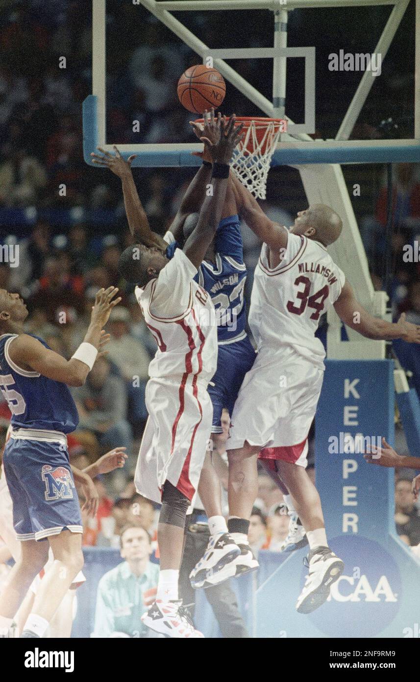 Arkansas Elmer Martin, left, and Corliss Williamson (34) go up for the ...