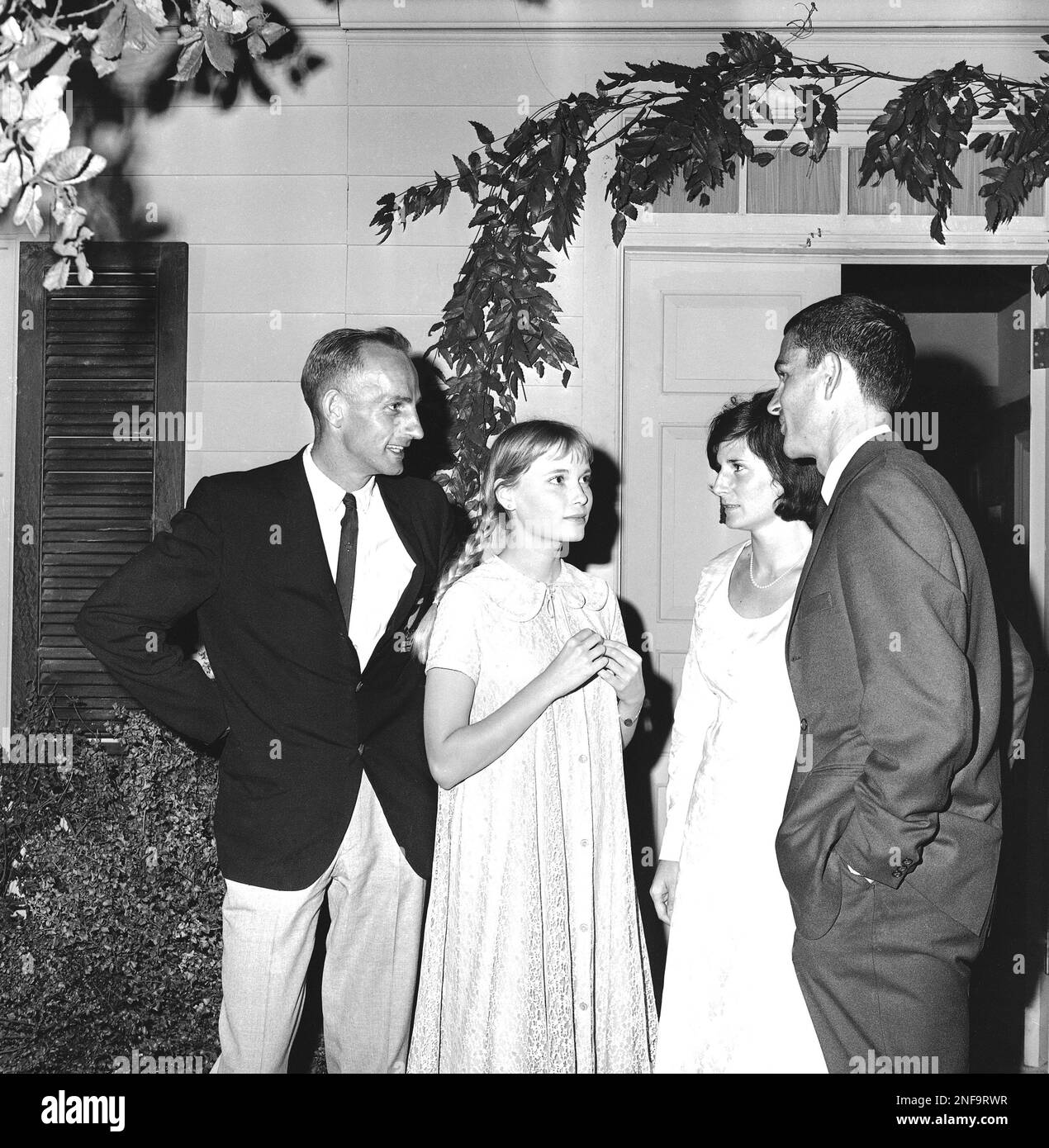 Actor Mia Farrow, second from left, visits with Neville Scott of New ...