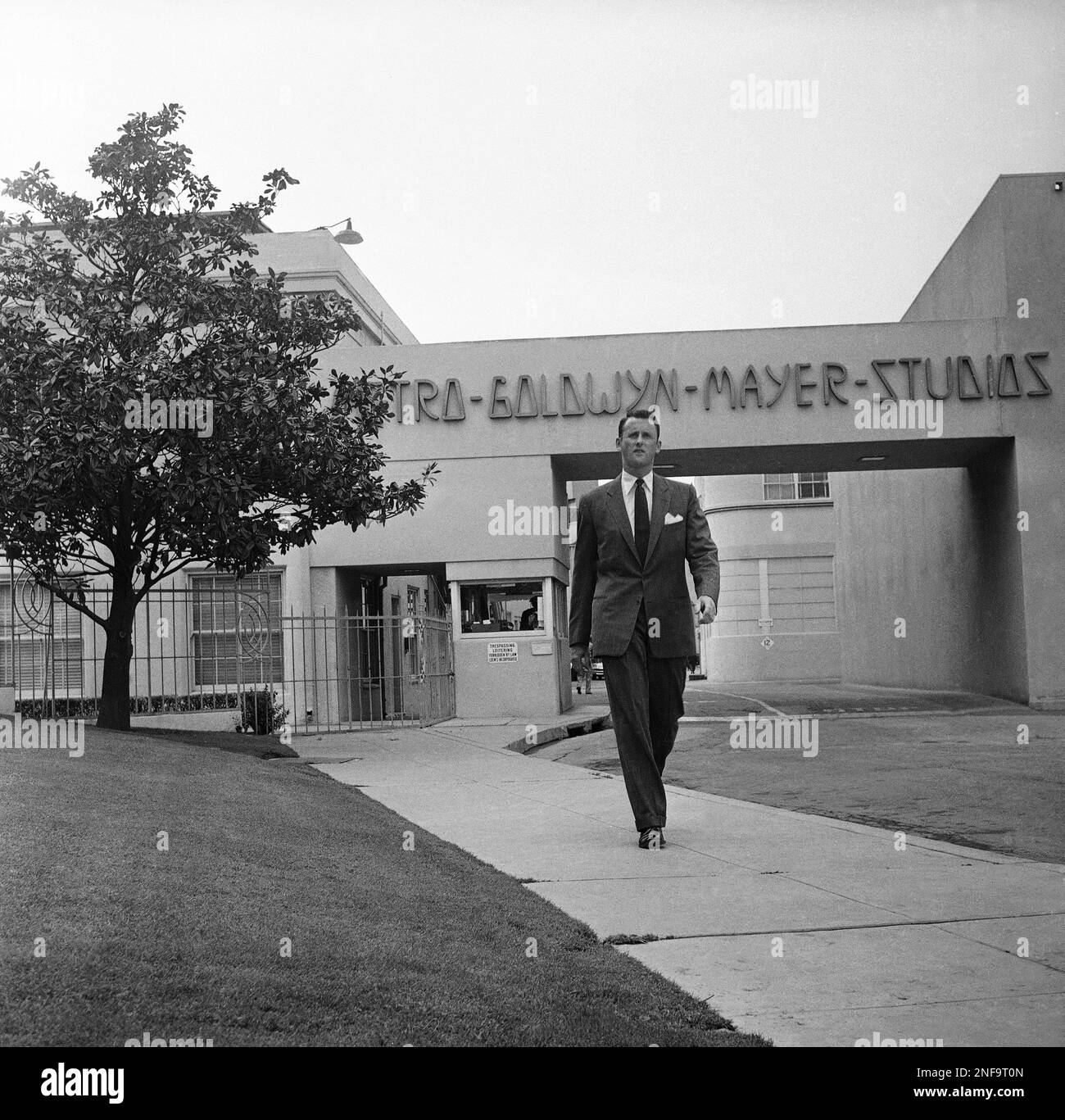 Samuel Goldwyn, Jr., poses outside the main gate at Metro-Goldwyn-Mayer ...