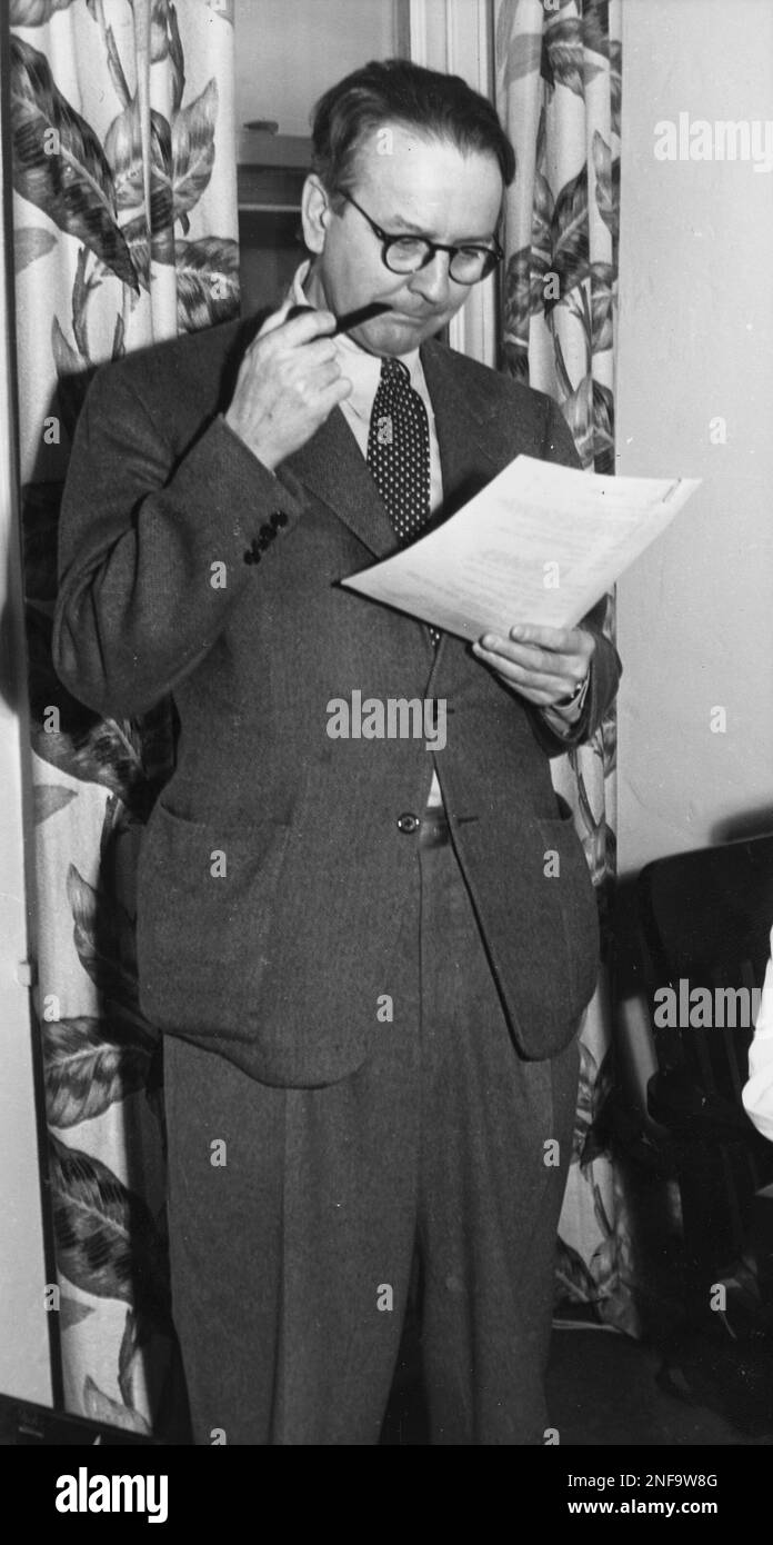 U.S. writer Raymond Chandler is seen reading a page of a new murder ...