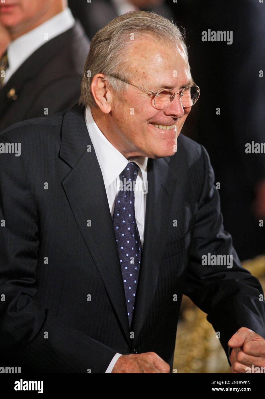 Former Defense Secretary Donald H. Rumsfeld talks with guests in the ...