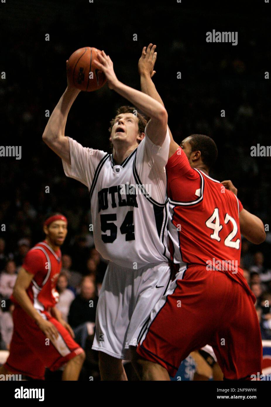 Butler forward Matt Howard, left, shoots in front of Detroit forward ...