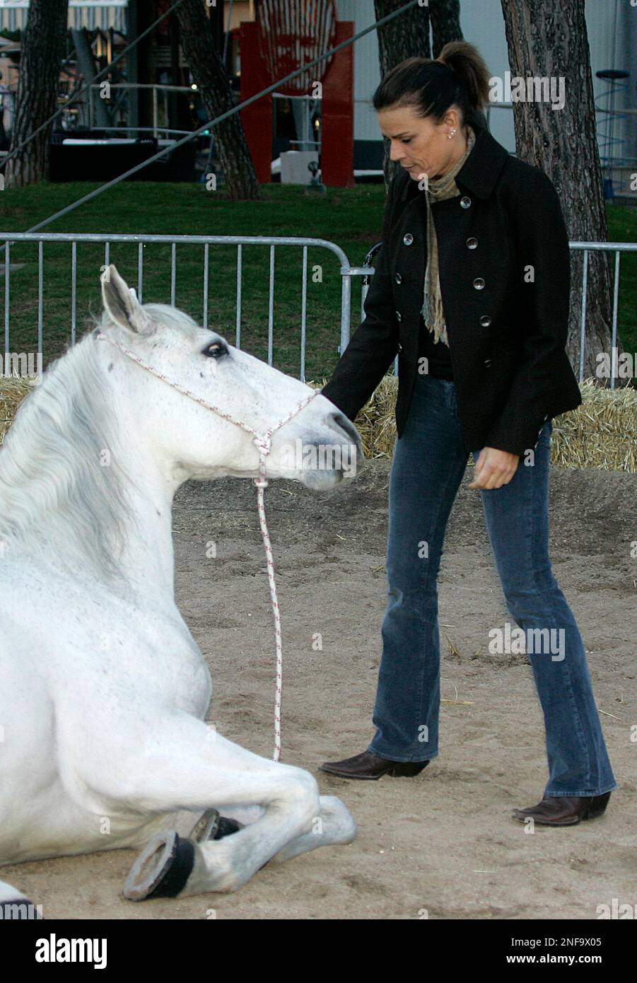 Princess Stephanie of Monaco poses with a horse as she presents the ...