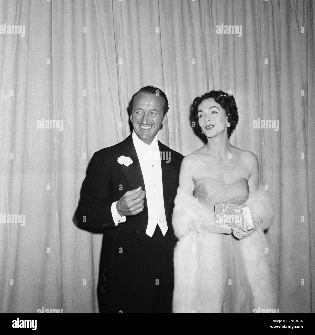 Actor David Niven, nominated for the best actor award, and his wife ...