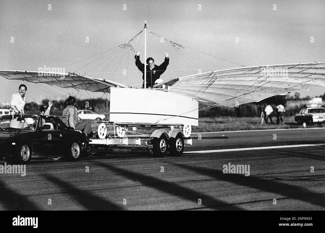 Actor Cliff Robertson signals success after he test-piloted a replica ...