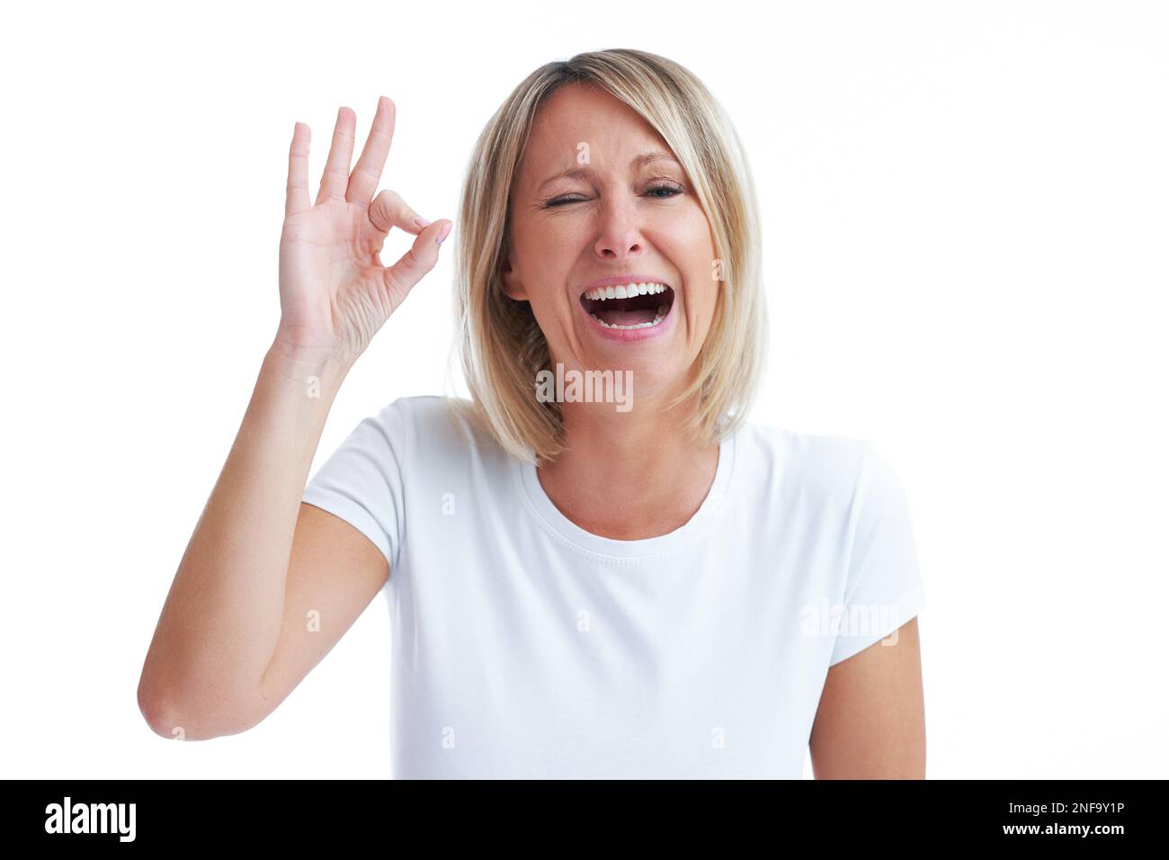 Picture of blonde woman over back isolated background Stock Photo - Alamy
