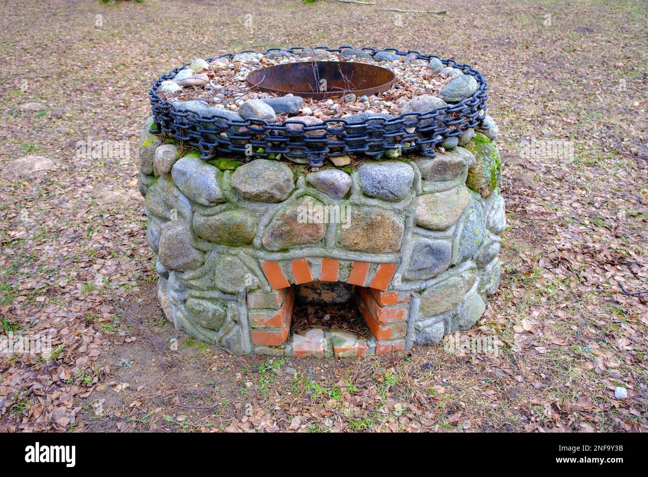 idyllic outdoor barbecue area - built with flat stones campfire place ...