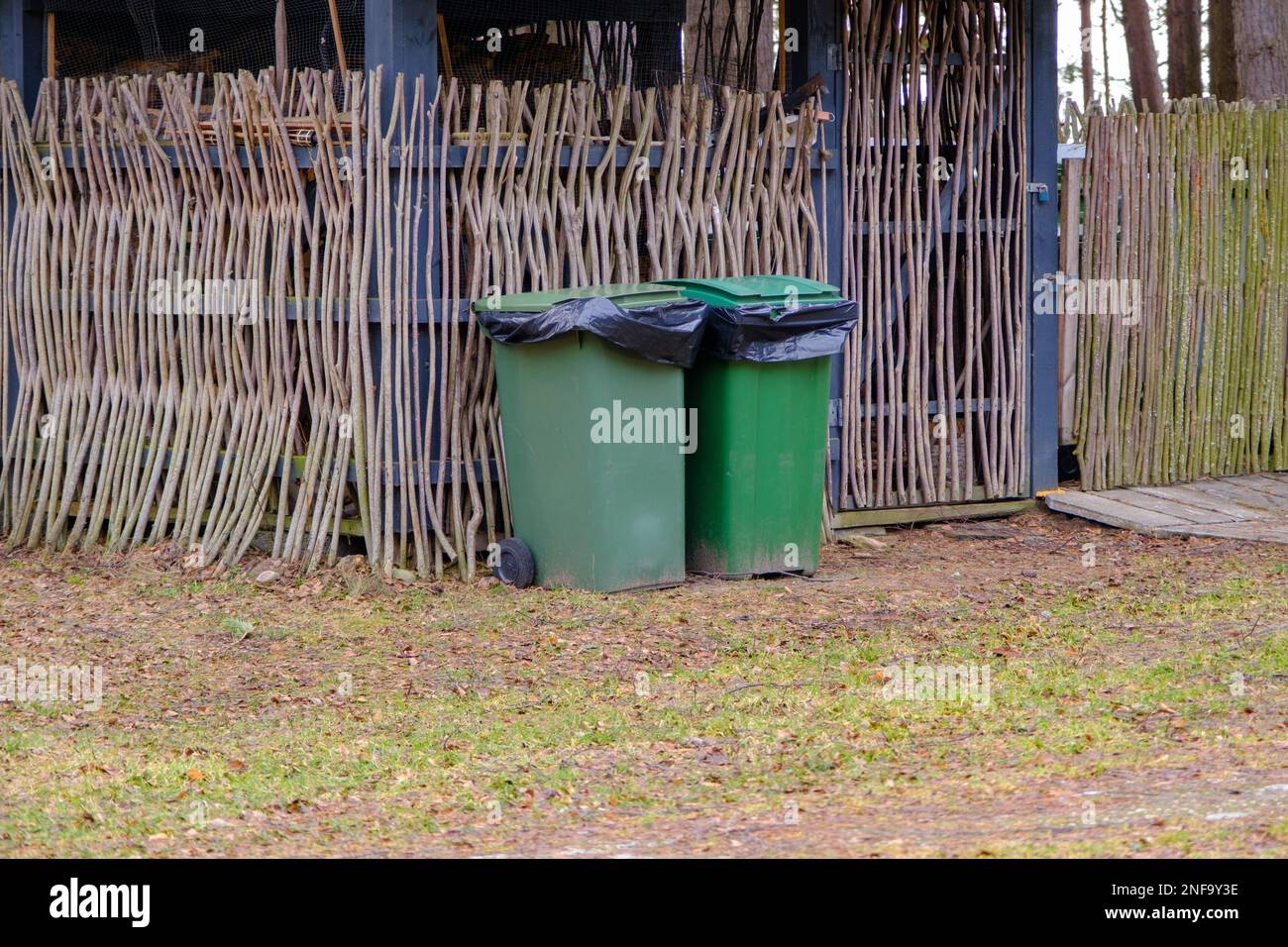 Two green trash bin for disposing of organic and inorganic waste Stock ...
