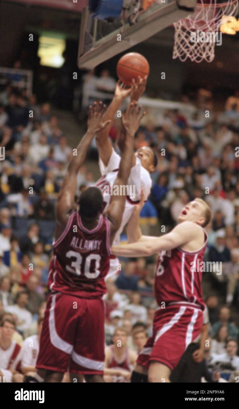 Massachusetts’s Marcus Camby goes to the hoop over Stanford’s Darren ...
