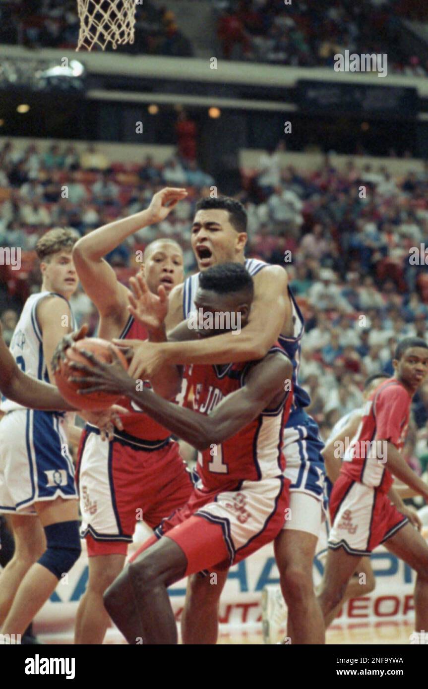 Alaa Abdelnaby (30) of Duke goes over the top of St. John’s Malik Sealy ...