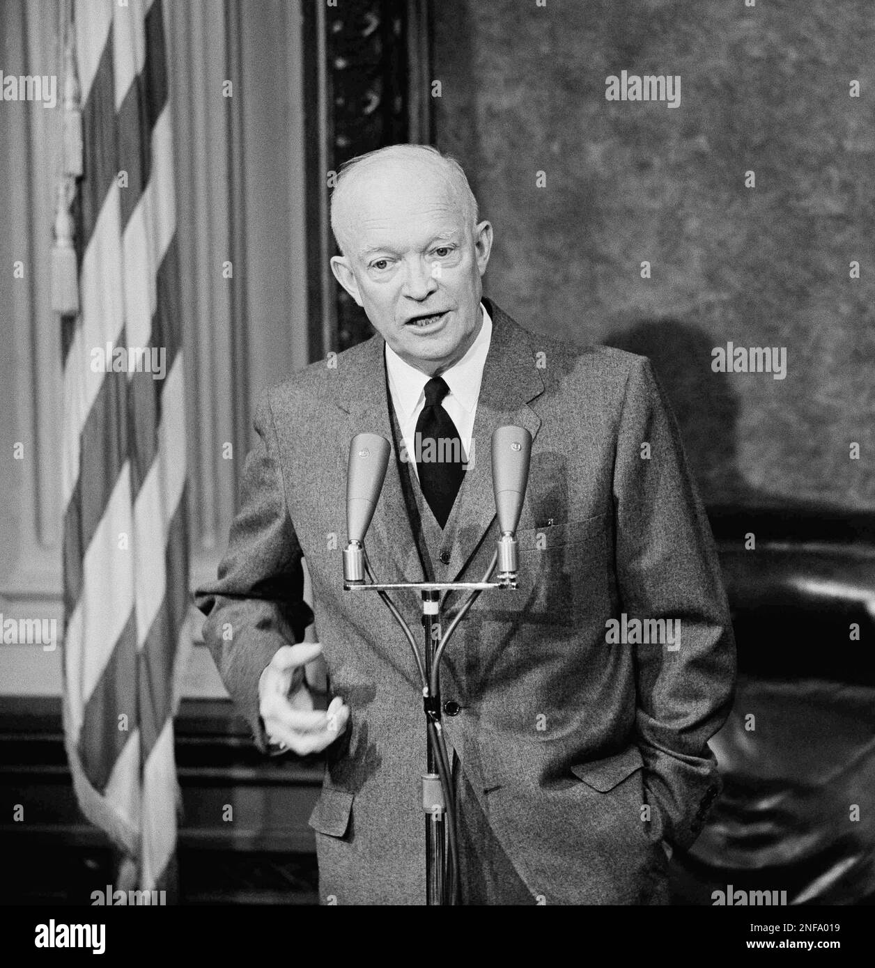President Dwight D. Eisenhower answers a question at his press ...