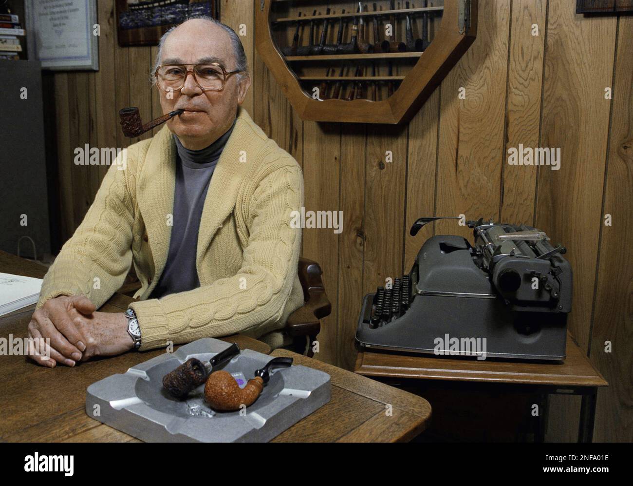 Screenwriter John Michael Hayes, poses in his Lebanon, N.H., home with ...