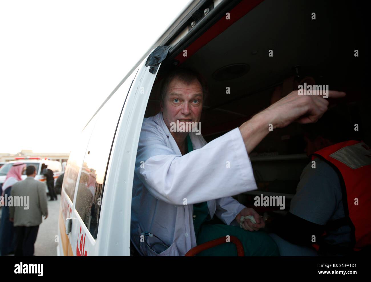 Norwegian doctor Eric Fosse is seen at a Palestinian ambulance while ...