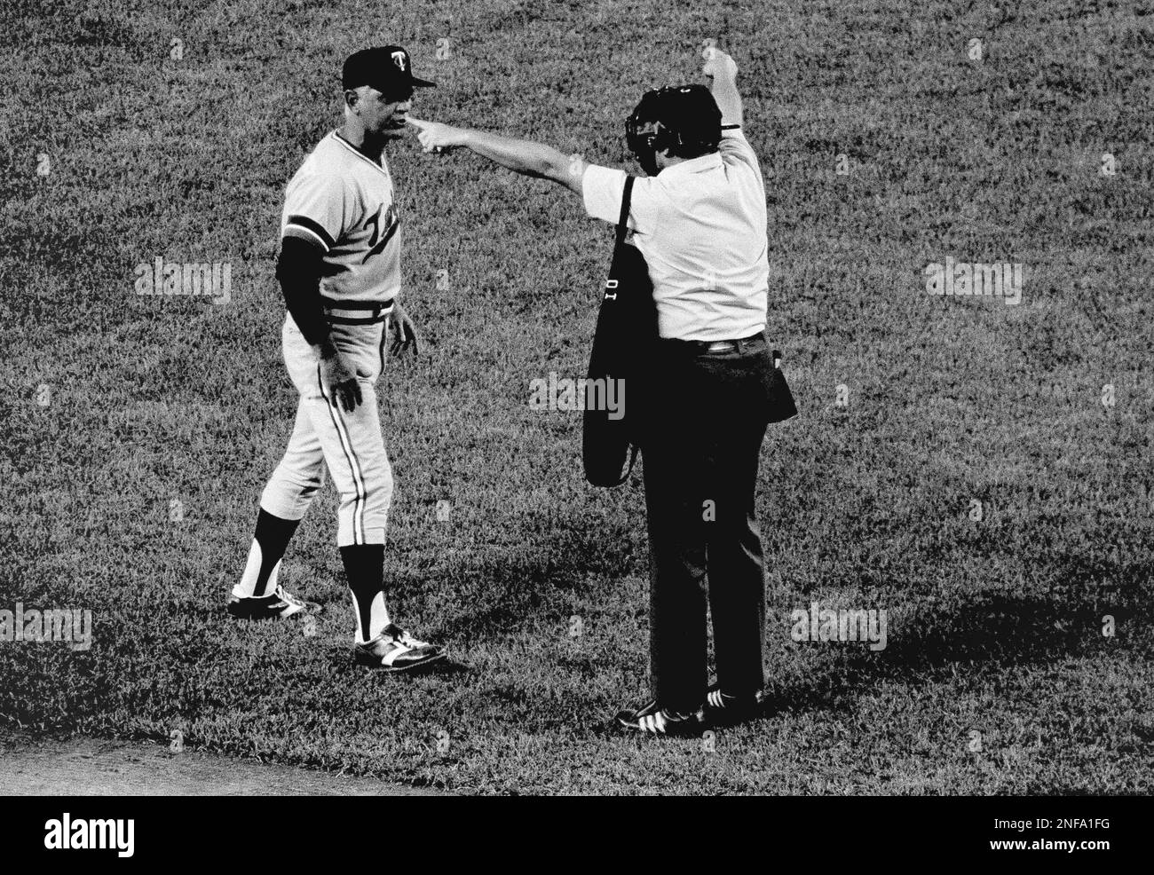 Minnesota Twins manager Gene Mauch, left, gets the point from home ...