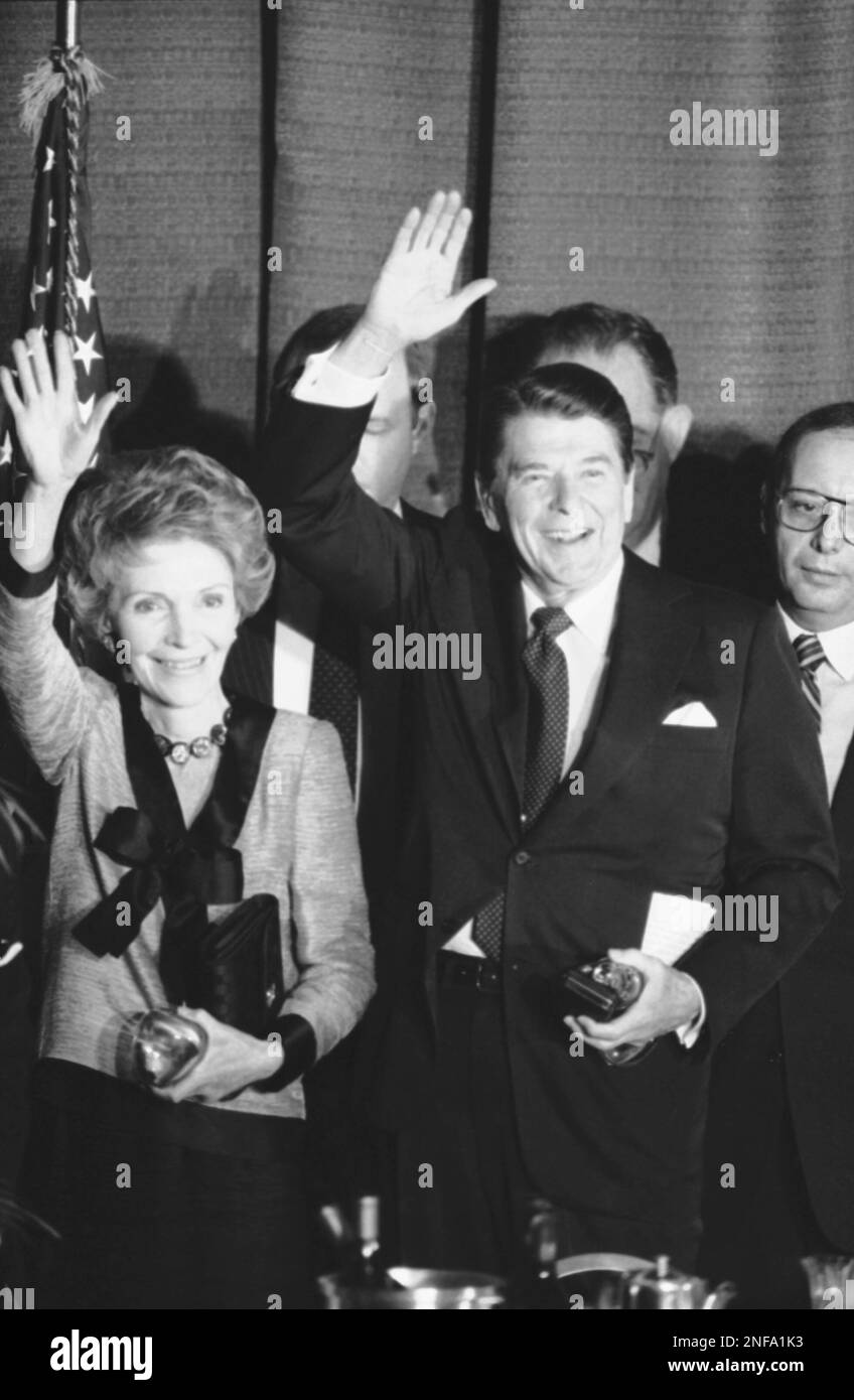 U.S. President Ronald Reagan and Nancy Reagan wave as they depart New ...