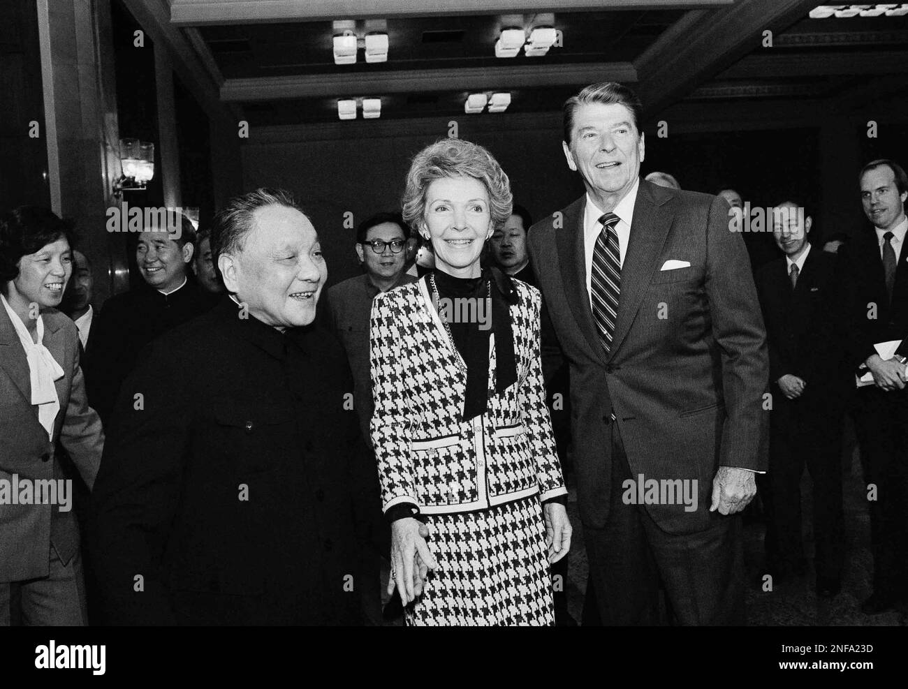 Chinese leader Deng Xiaoping holds hands with Mrs. Nancy Reagan as they ...