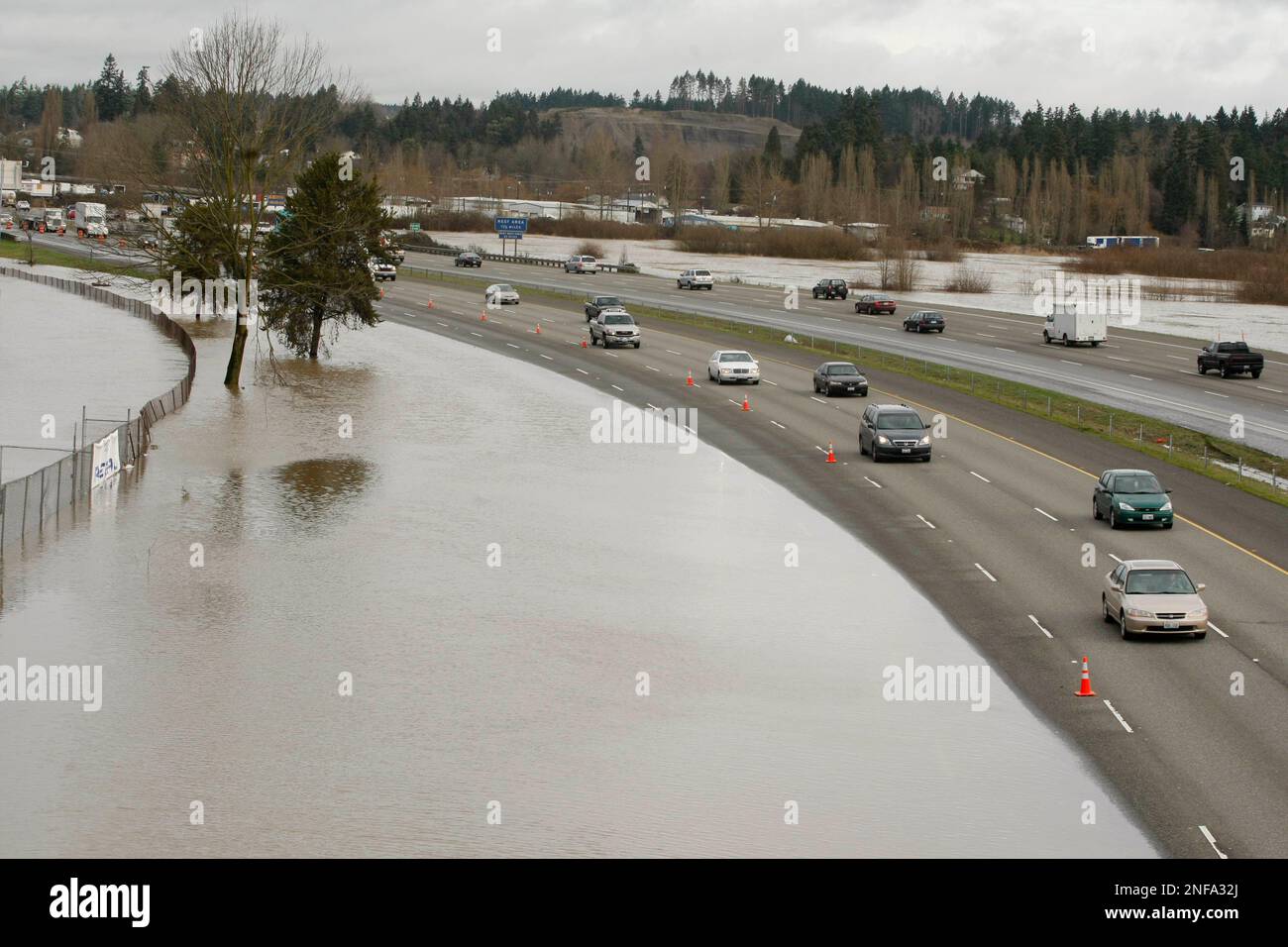 Traffic works around two blocked lanes of Interstate 5 that are closed ...