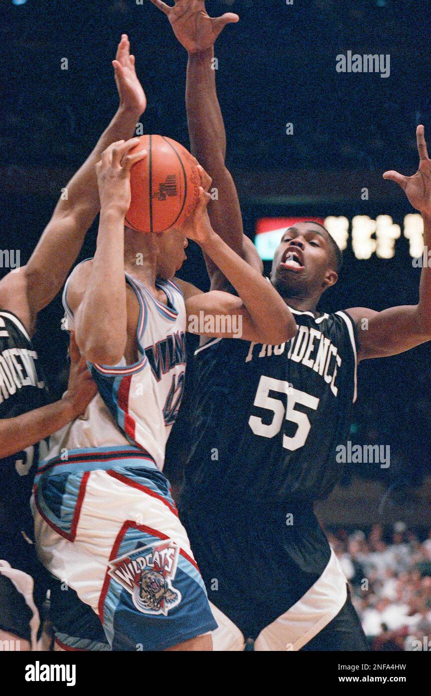 Jason Lawson, left, of Villanova is guarded by Eric Williams of ...
