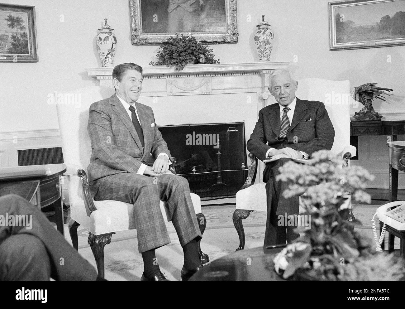 President Ronald Reagan meets in the Oval Office of the White House ...